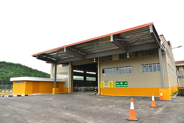 All-weather packaged waste unloading area